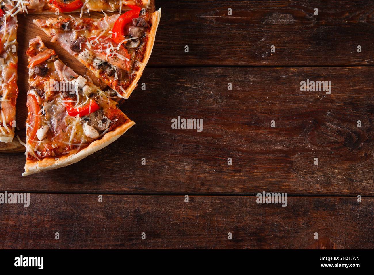 Italian food background. Pizza slices on table Stock Photo - Alamy