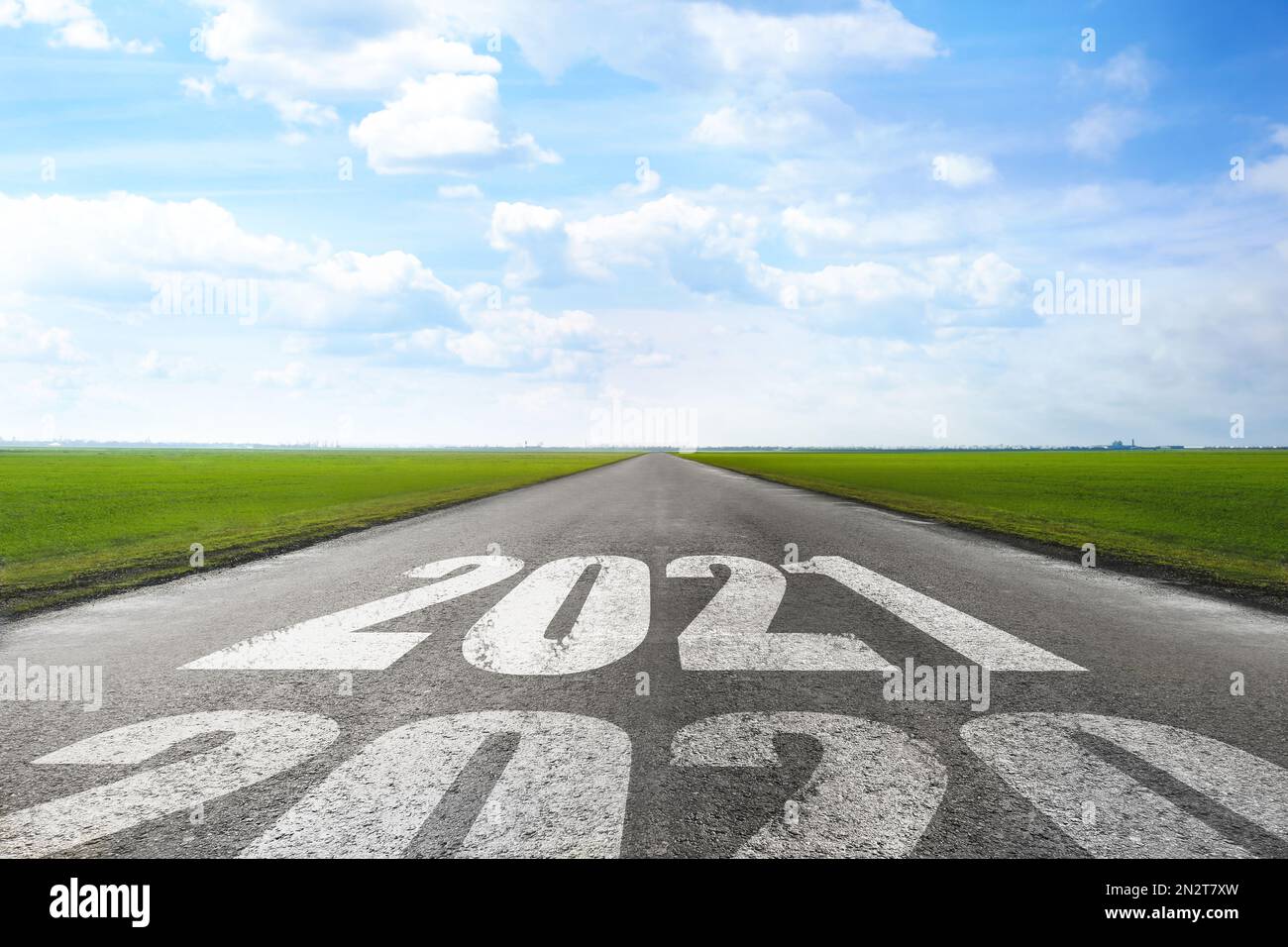 Start new year with fresh vision and ideas. 2021 numbers on asphalt ...