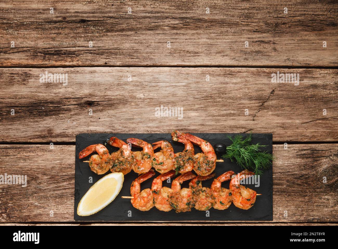 Fried prawns on black slate. Mediterranean food Stock Photo - Alamy