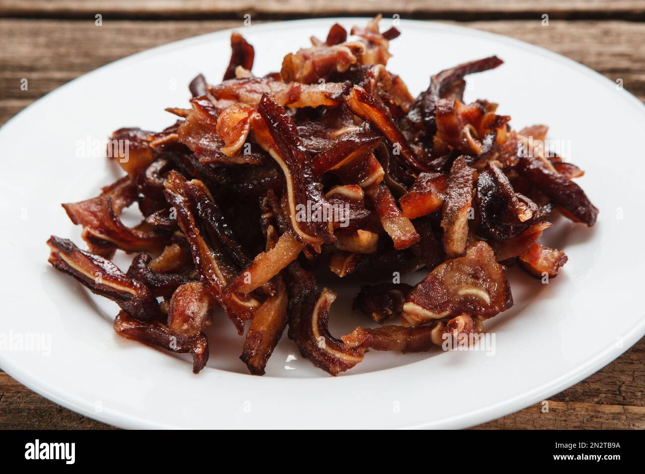 Junk food. Smoked snacks for beer on wood table Stock Photo - Alamy