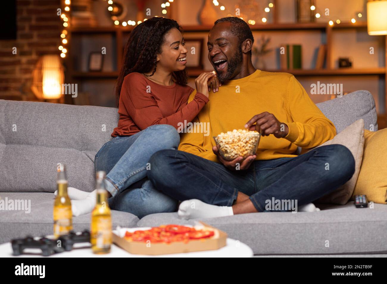 Woman feeding pizza man hi-res stock photography and images - Alamy