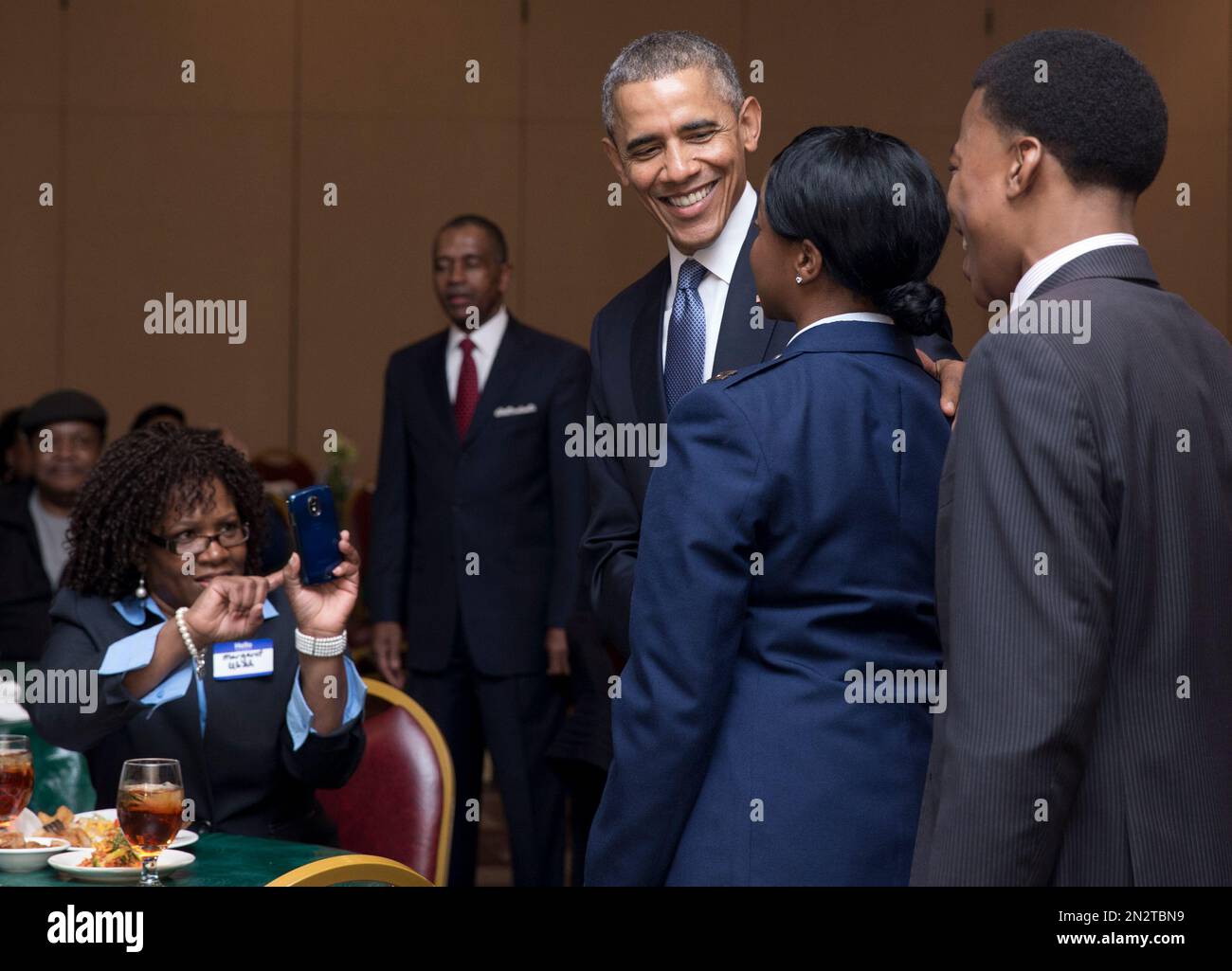 President Barack Obama visits people at the Brookland Banquet and ...