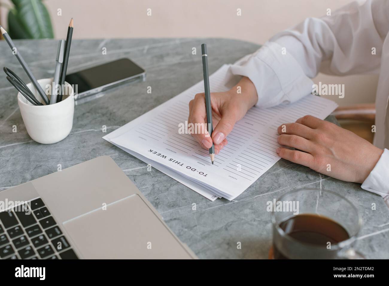 Writing a list woman hi-res stock photography and images - Alamy