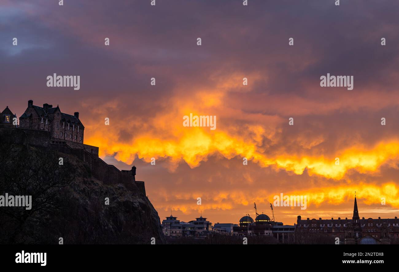 Fiery orange sunset over Edinburgh Castle and city centre, Edinburgh ...