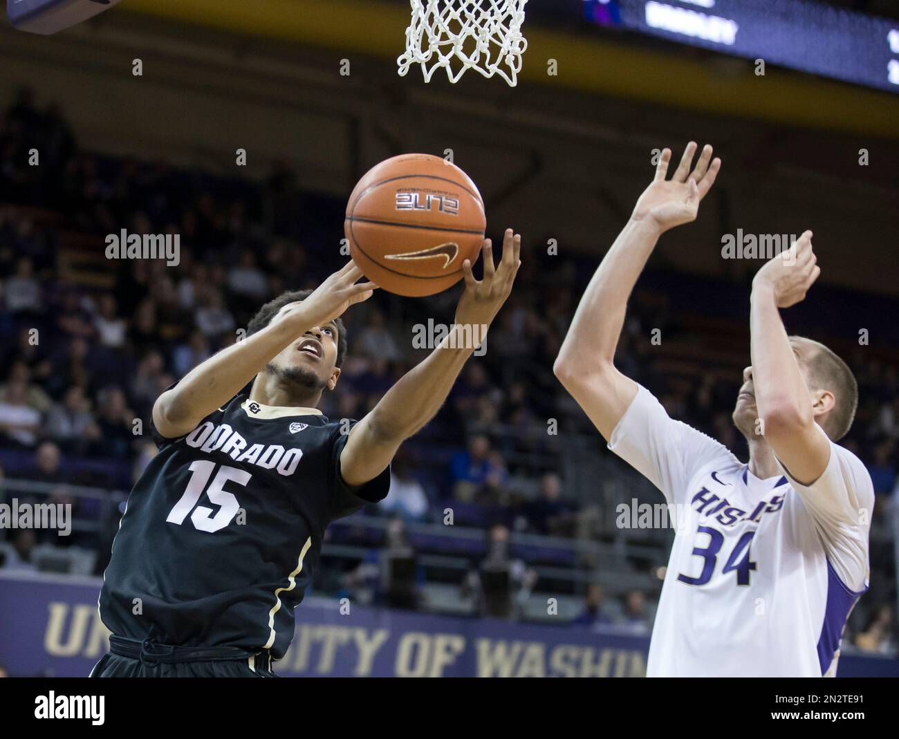 Colorado's Dominique Collier shoots the ball as Washington's Gilles ...