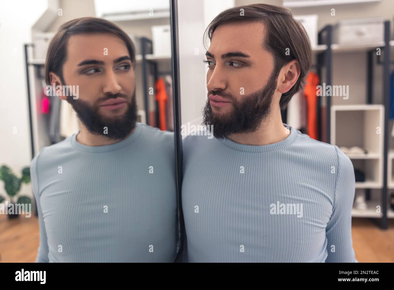 Male examining his mirror reflection after the makeup application Stock ...