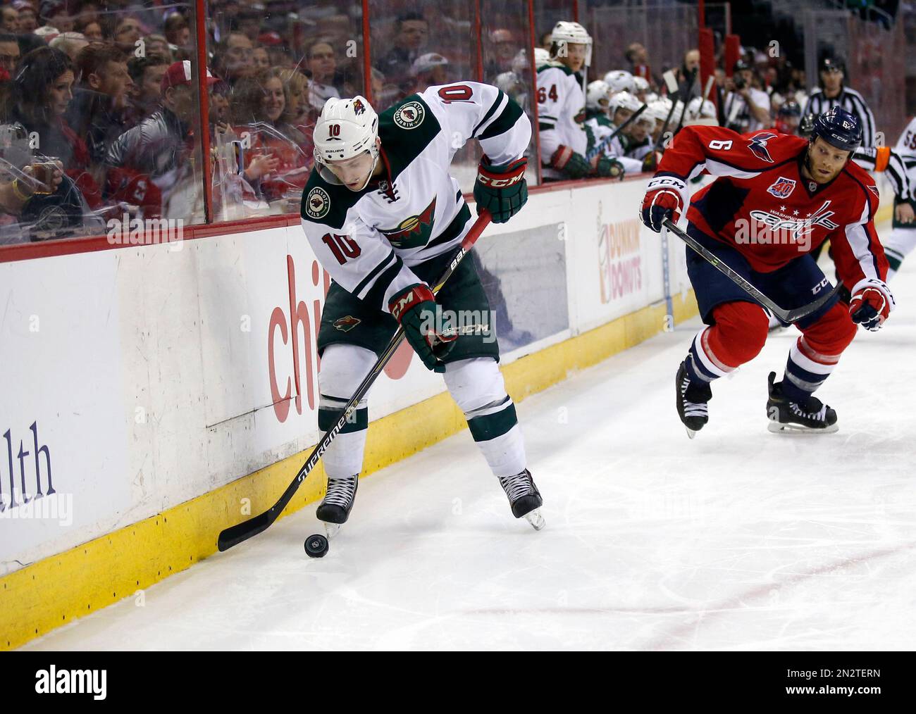 Minnesota Wild center Jordan Schroeder (10) skates with the puck with ...
