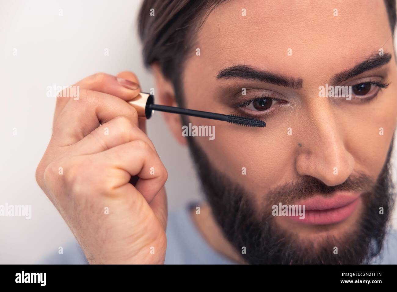 Man applying makeup transgender hi-res stock photography and images - Alamy