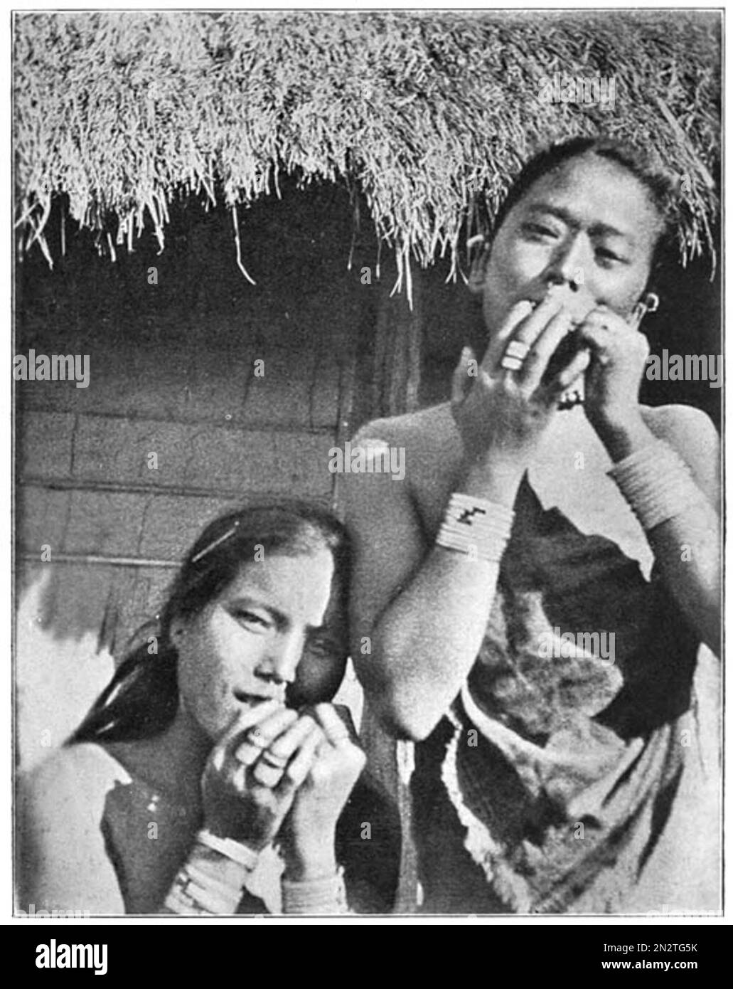 Boro woman playing harp Stock Photo - Alamy