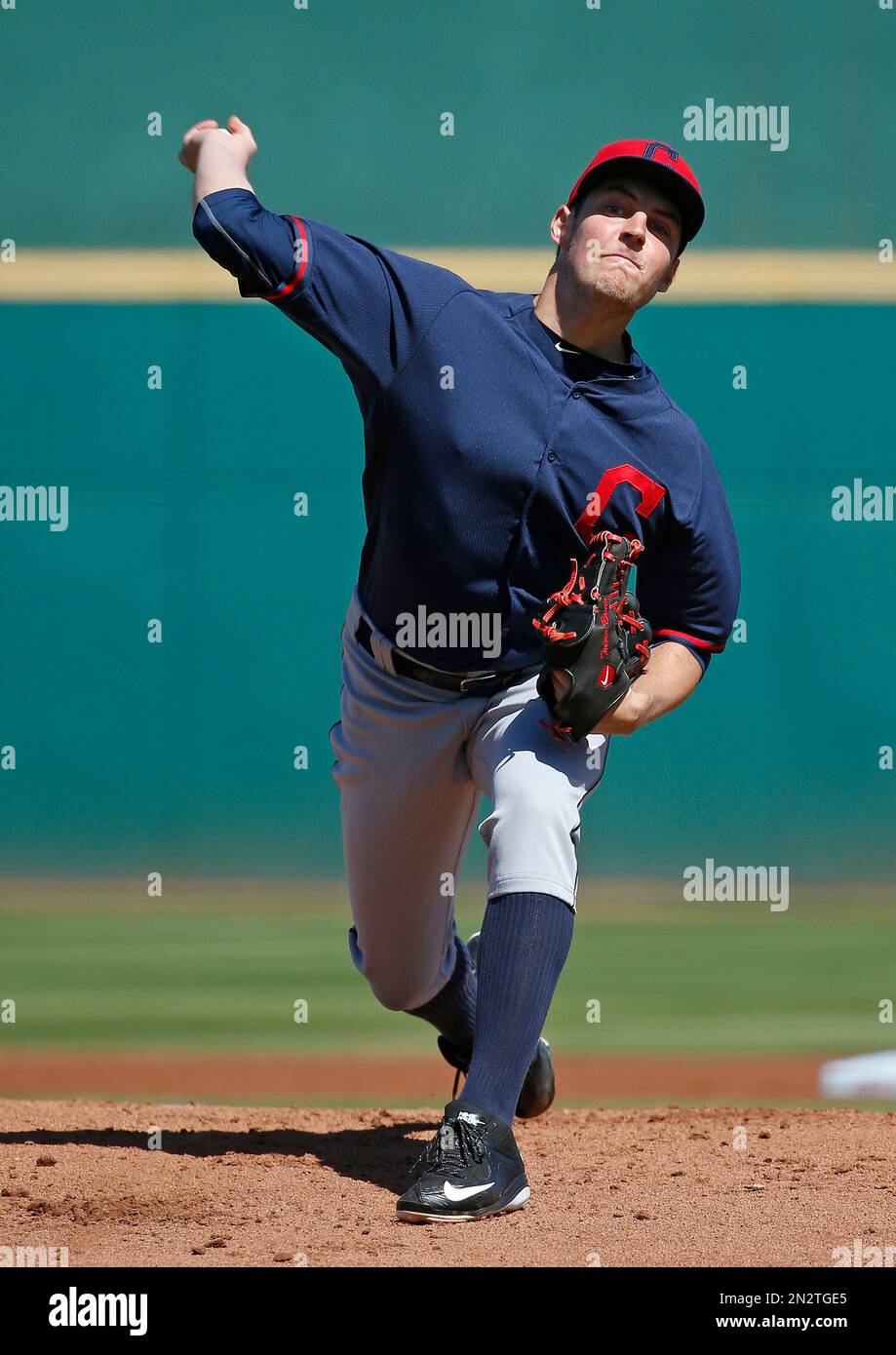 Cleveland Indians' Trevor Bauer pitches in the first inning of a spring ...