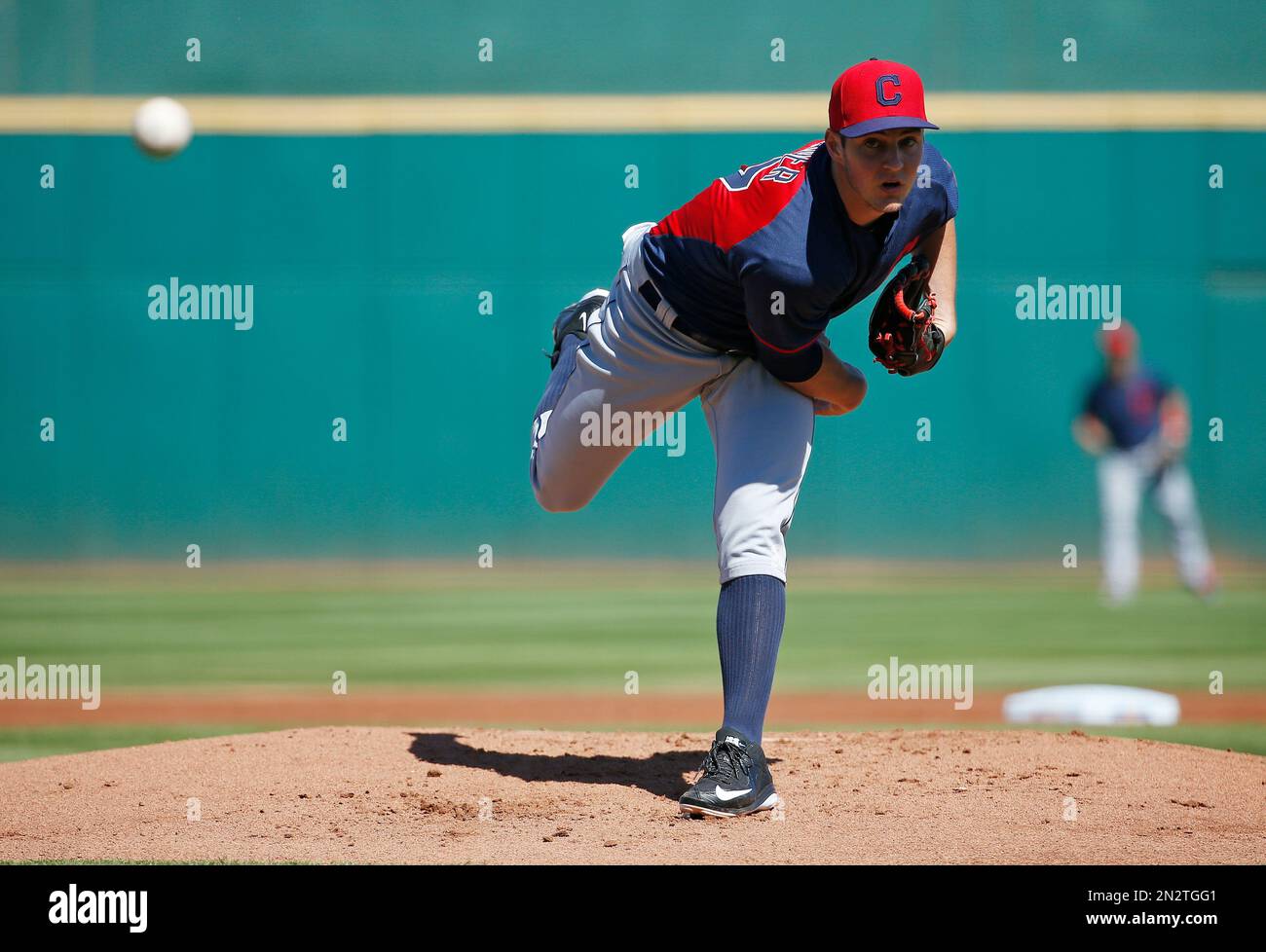 Cleveland Indians' Trevor Bauer pitches in the first inning of a spring ...