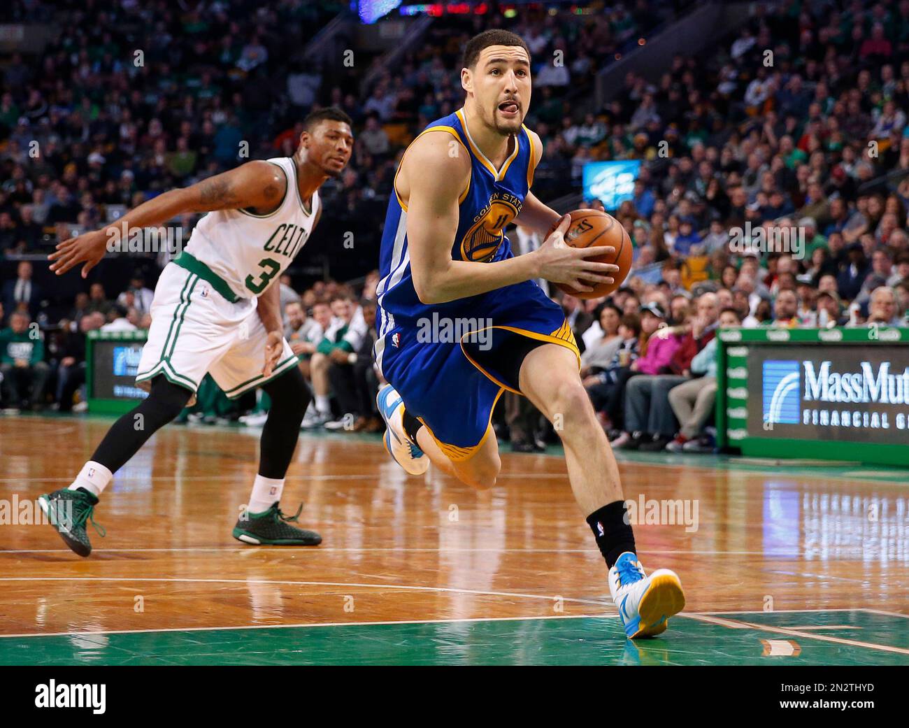 Golden State Warriors' Klay Thompson drives past Boston Celtics' Marcus ...
