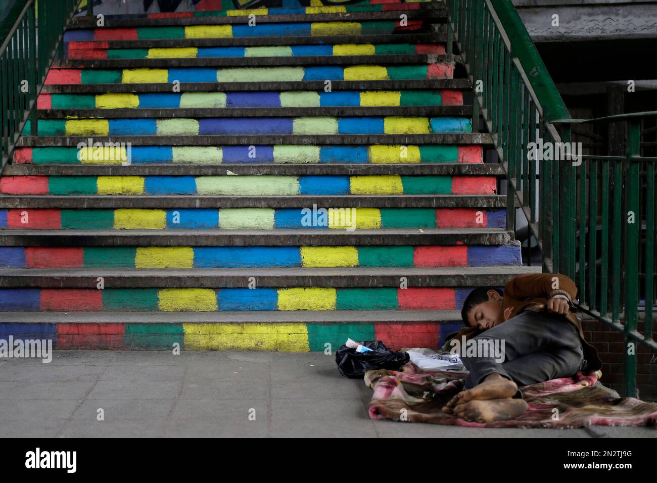 A homeless Egyptian child sleeps under a bridge in Cairo, Egypt ...