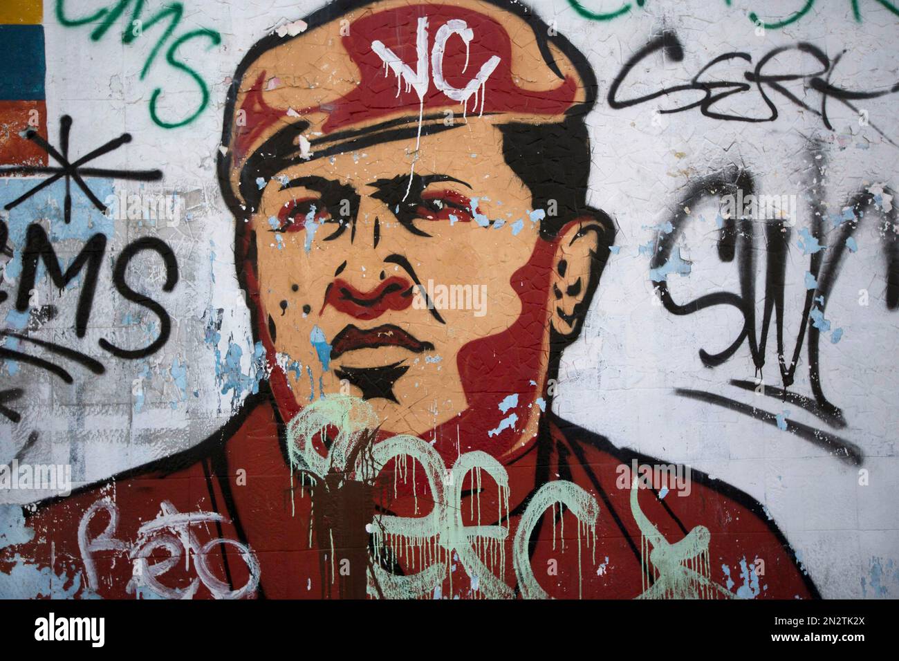 A mural of Venezuela's late President Hugo Chavez covers a wall in ...