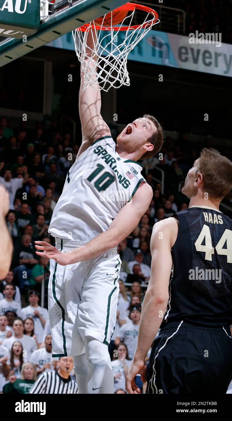 Michigan State's Matt Costello (10) dunks against Purdue's Isaac Haas ...