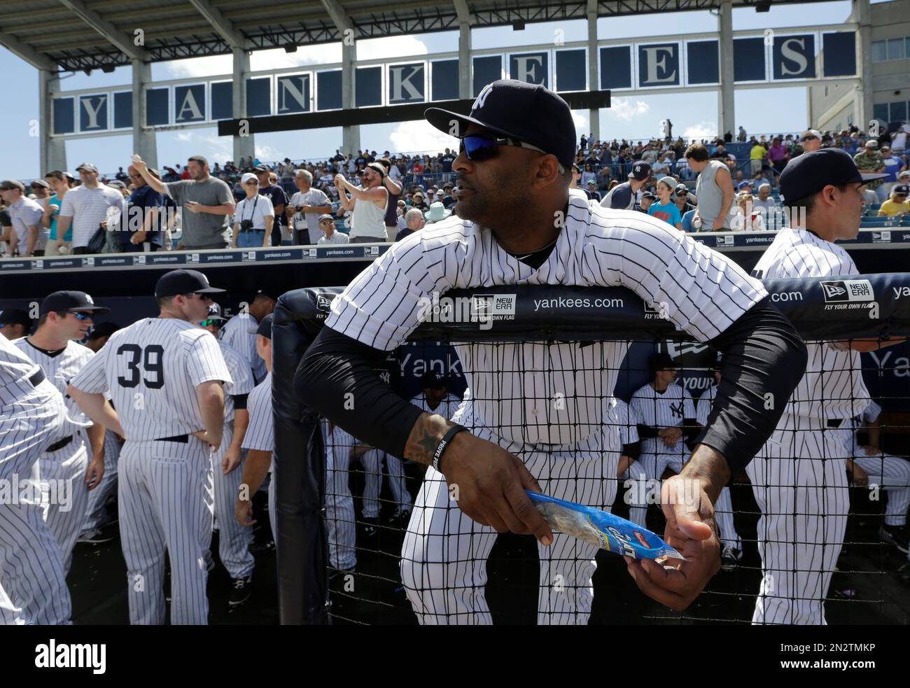New York Yankees starting pitcher CC Sabathia stands in the dugout ...