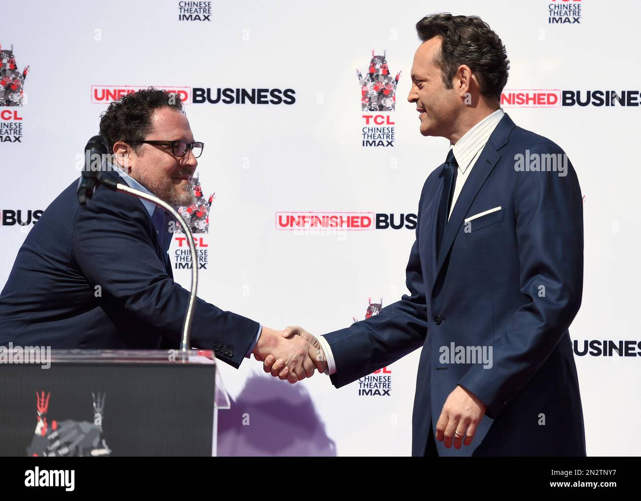 Jon Favreau, left, introduces Vince Vaughn to the stage at the Vince ...
