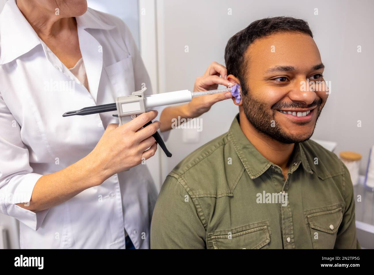 ENT doctor examining the patient with the medical apparatus Stock Photo ...