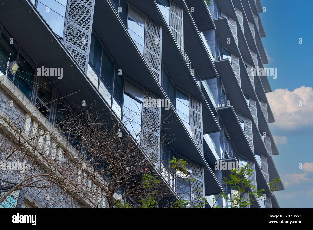 Modern sunset and apartments tall in high rise building hi-res stock ...