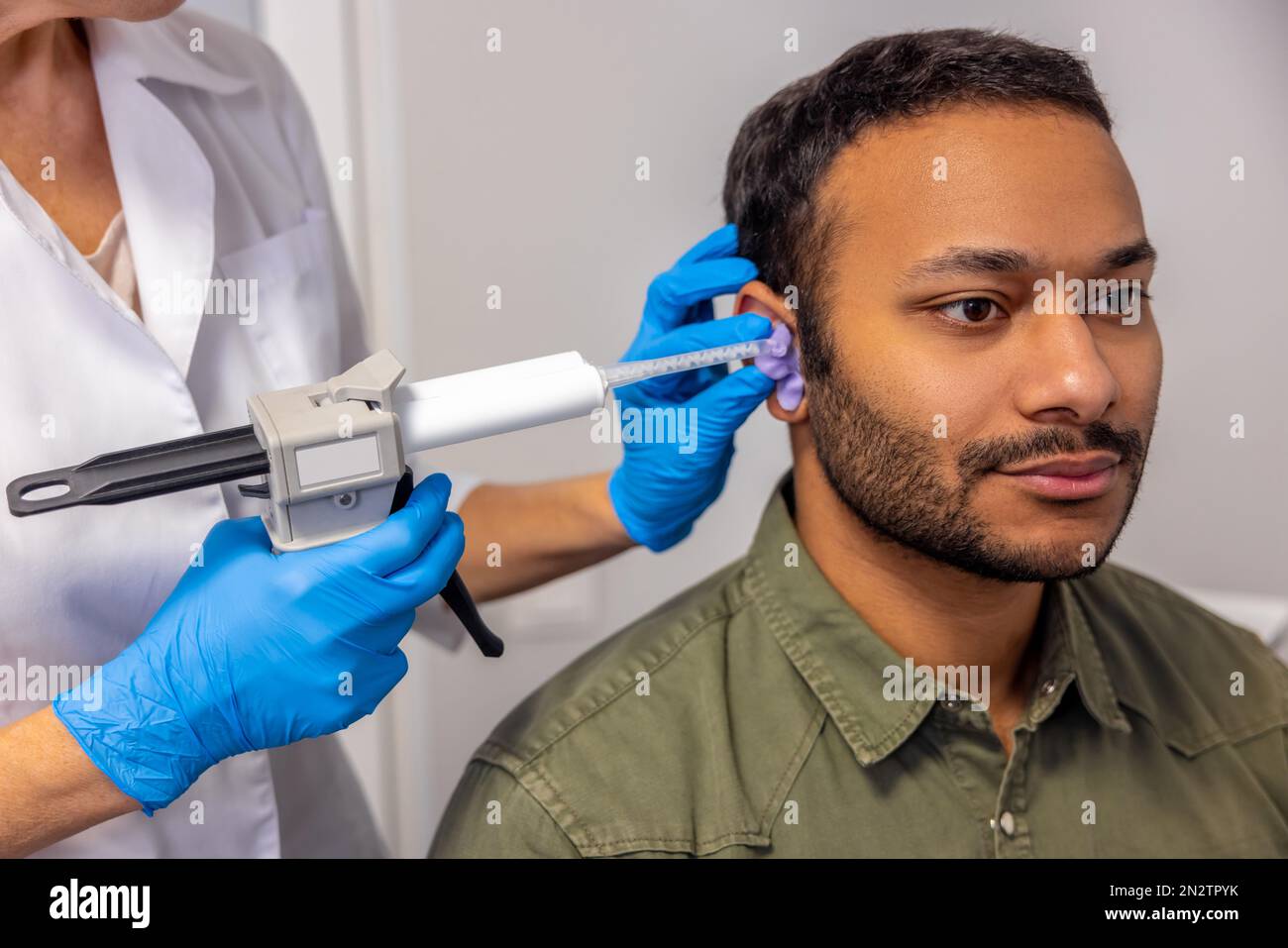ENT doctor examining the patient with the medical apparatus Stock Photo ...