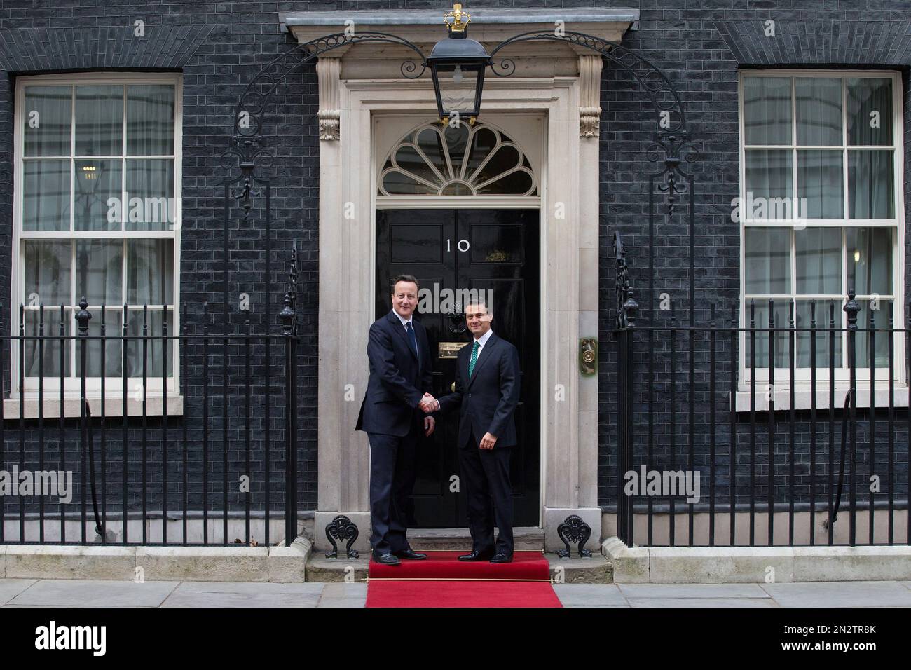 British Prime Minister David Cameron, left, greets the President of ...