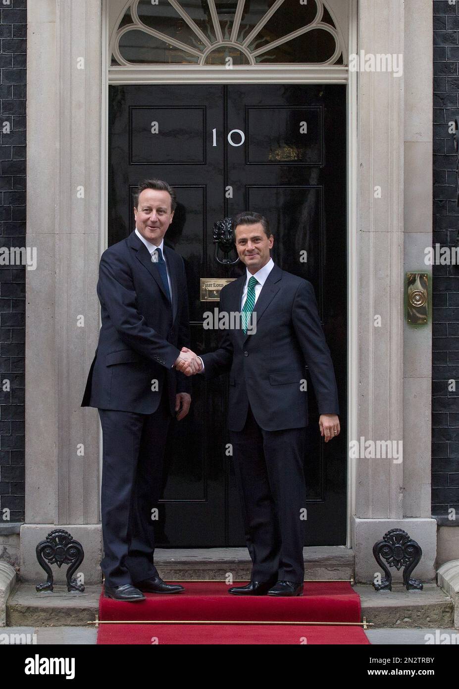 British Prime Minister David Cameron, left, greets the President of ...
