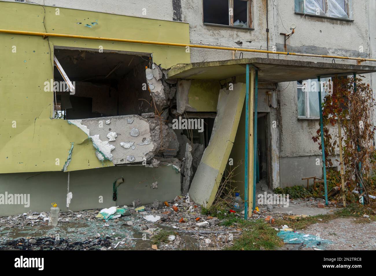 Entrance of an apartment building destroyed by shelling. War in Ukraine ...