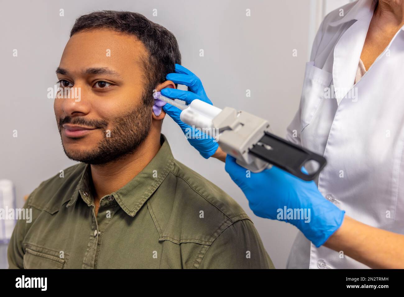 ENT doctor examining the patient with the medical apparatus Stock Photo ...