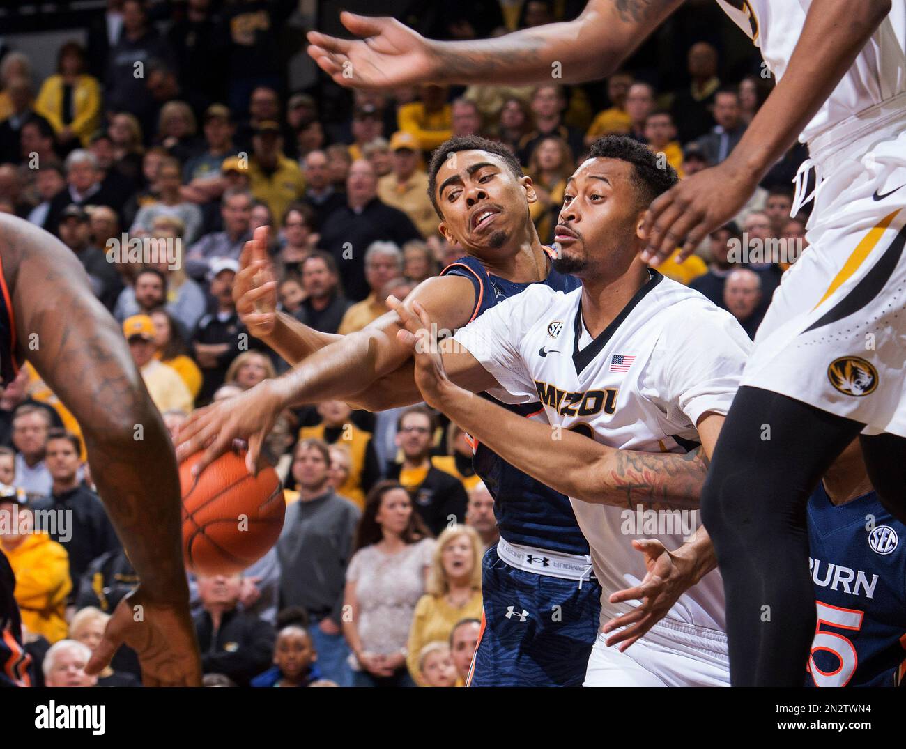 Missouri's Johnathan Williams III, right, has the ball knocked out of ...