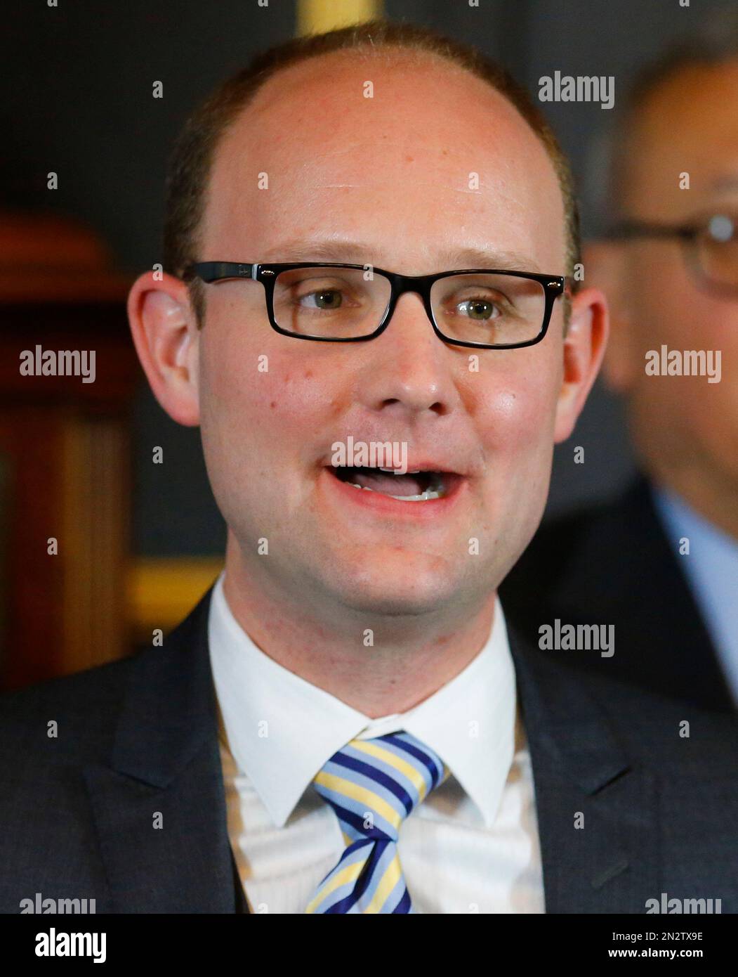 Oklahoma state Rep. Scott Inman, D-Oklahoma City, holds a sign against ...