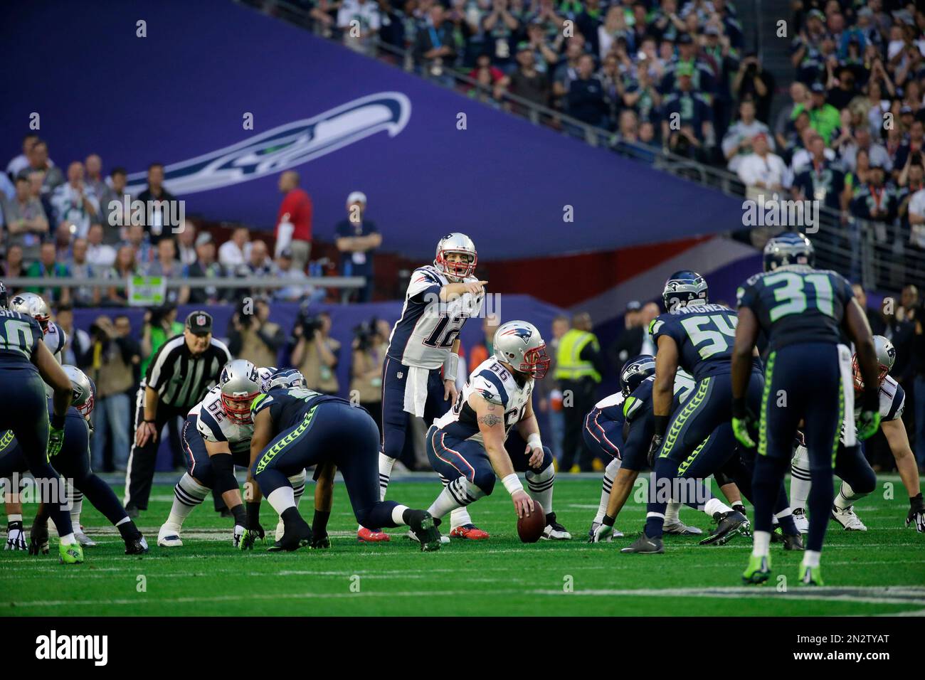 New England Patriots quarterback Tom Brady (12) calls signals during ...