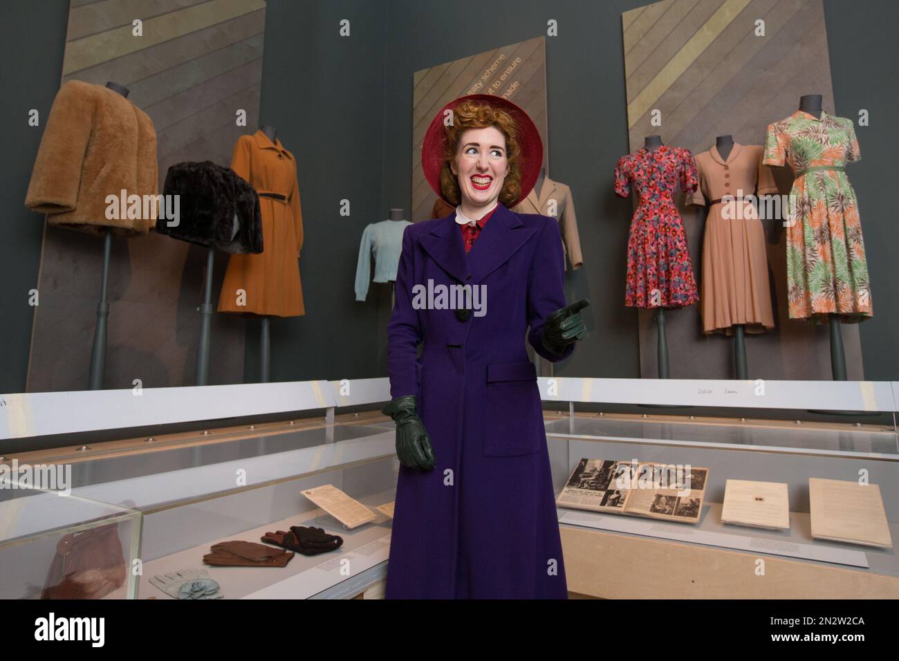 A model dressed in 1940s style clothing poses for pictures inside the ...
