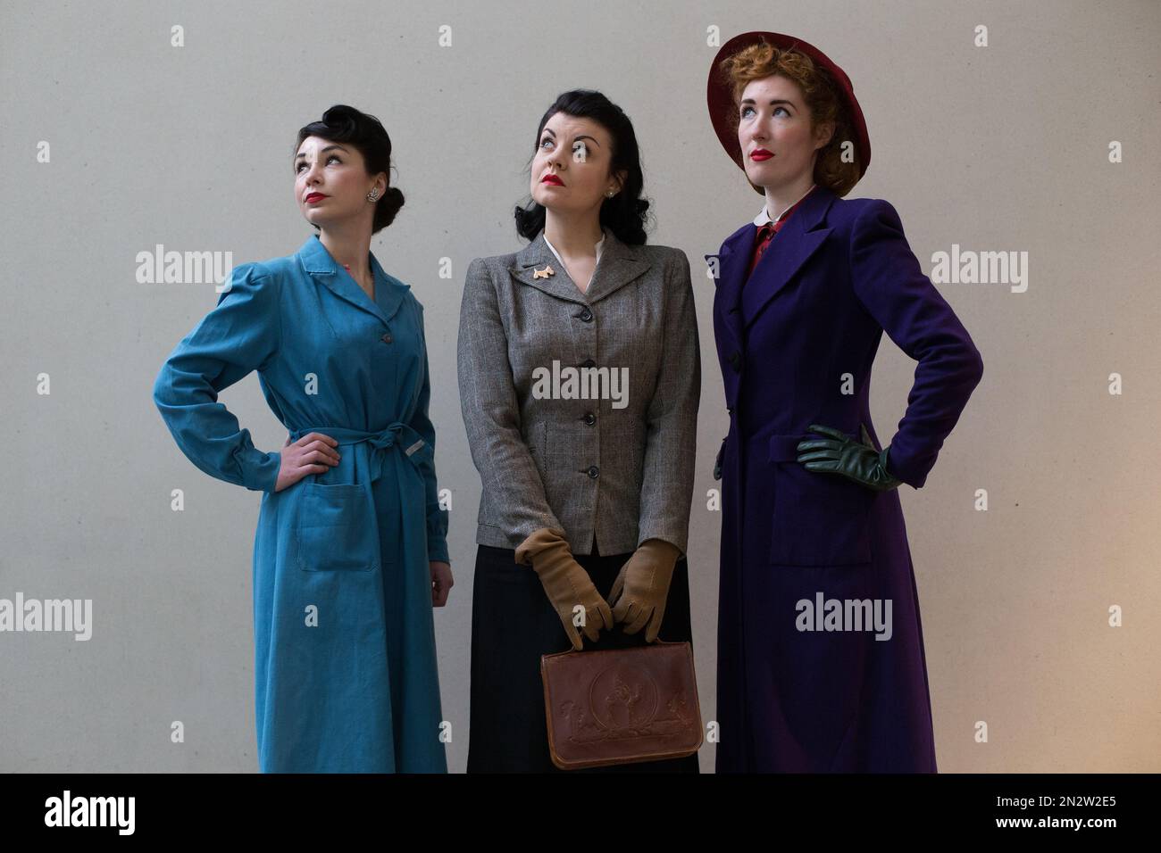 Models dressed in 1940s style clothing pose for pictures inside the ...