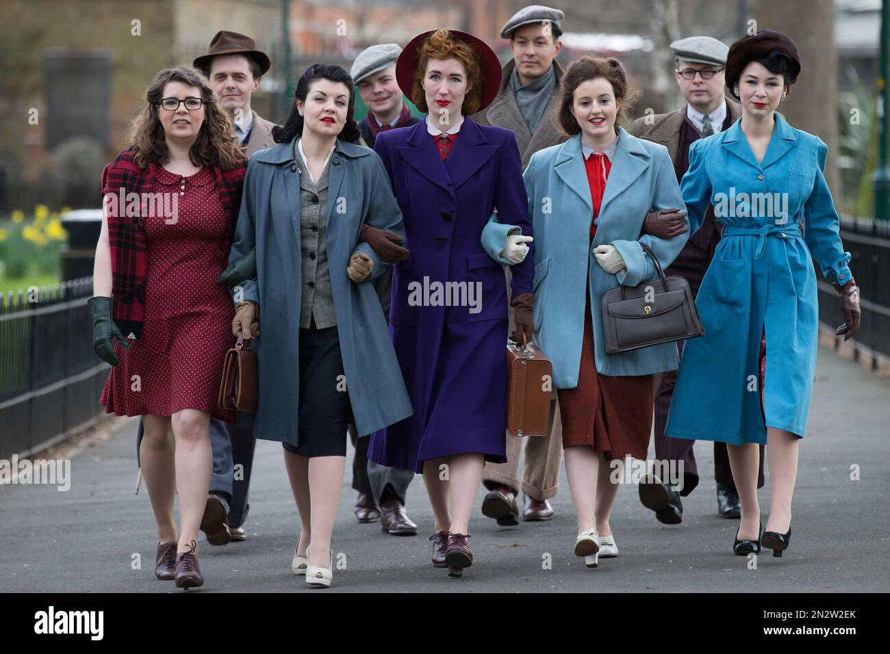 Models dressed in 1940s style clothing pose for pictures outside the ...