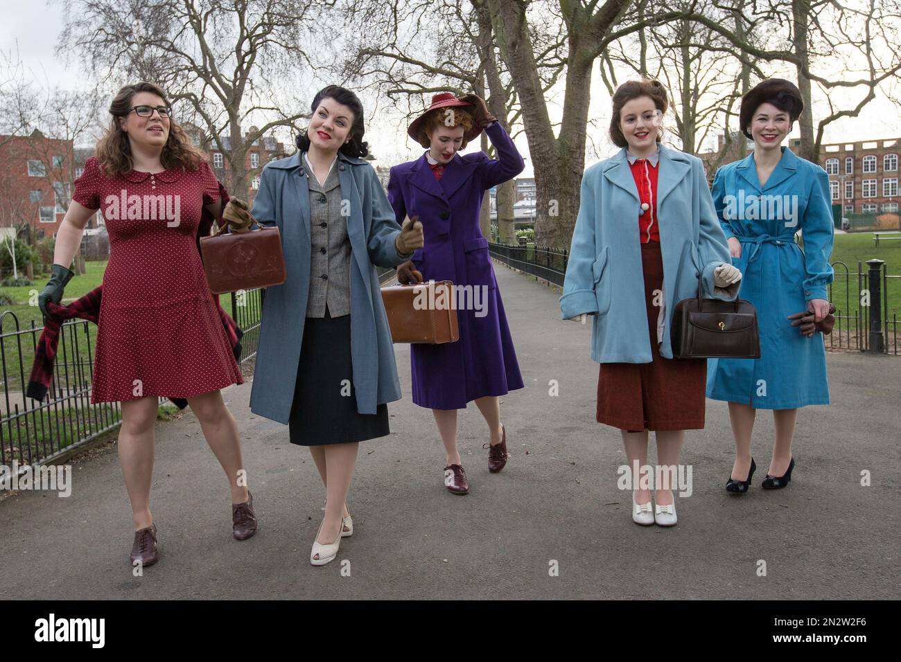 Models dressed in 1940s style clothing pose for pictures outside the ...