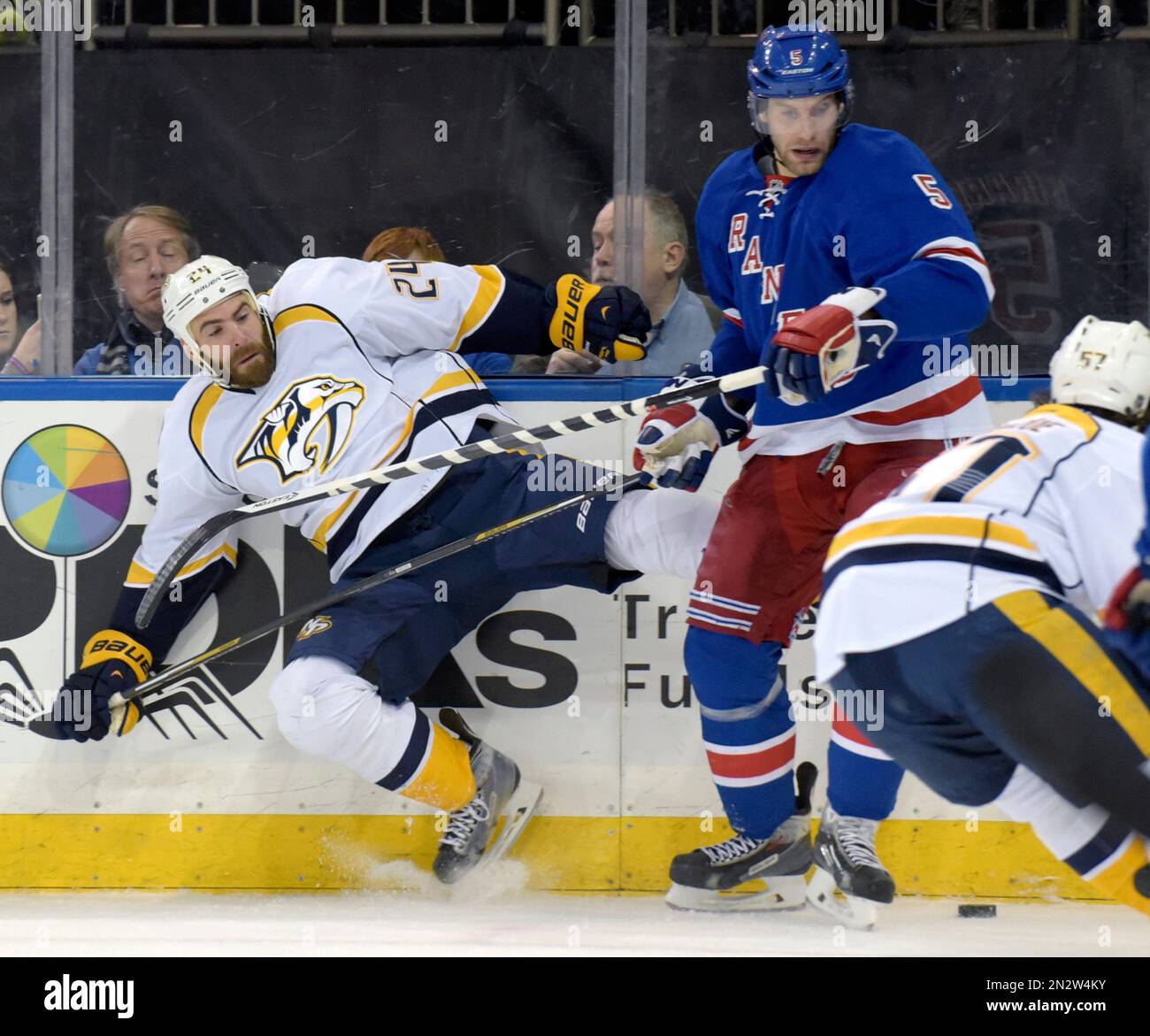 New York Rangers' Dan Girardi, right, checks Nashville Predators' Eric ...