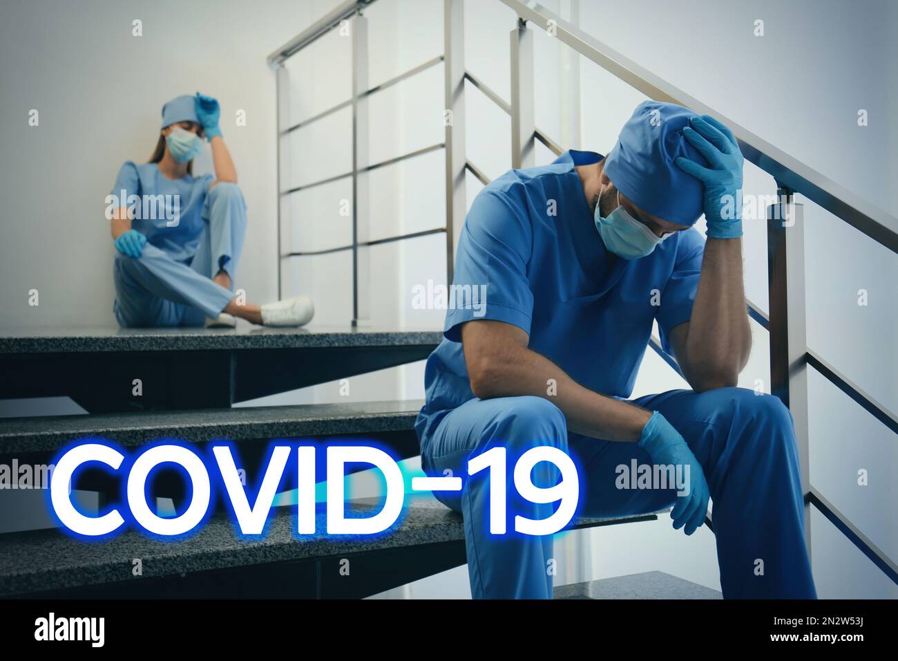 Tired overwhelmed doctor and nurse in hospital. Medical system collapse ...