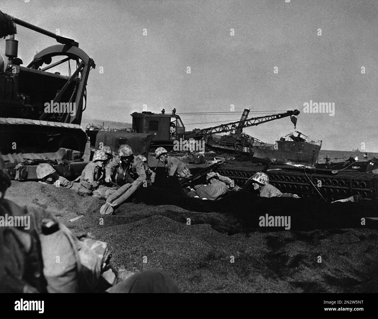 Heavy equipment as well as foxholes are employed by the Fourth Division ...
