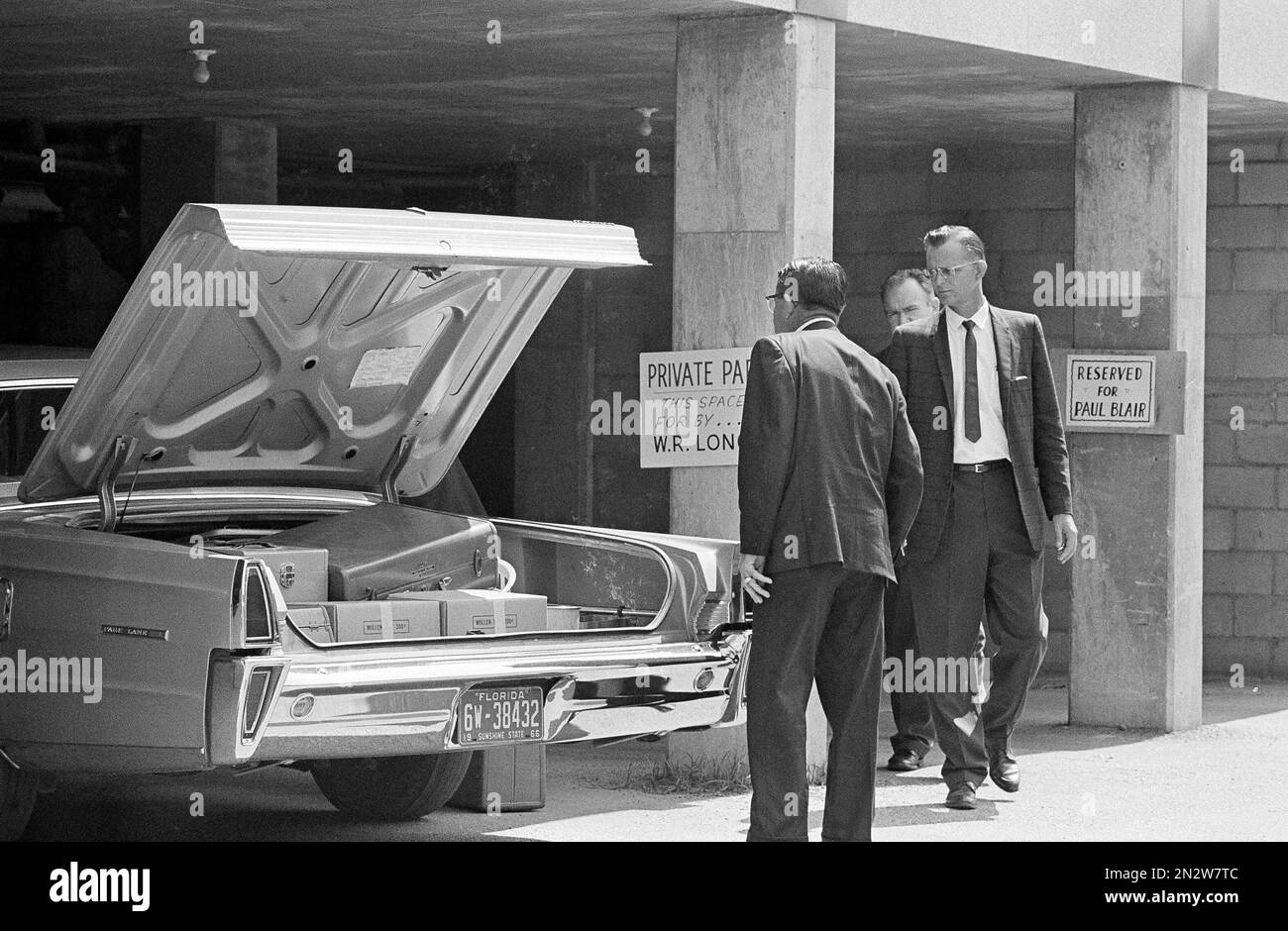 Charles A. Whitman, left, of Lake Worth, Fla., stares into the loaded ...