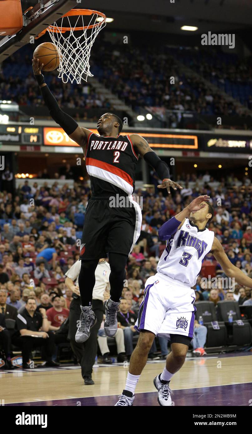 Portland Trail Blazers guard Wesley Matthews, left, goes for the layup ...