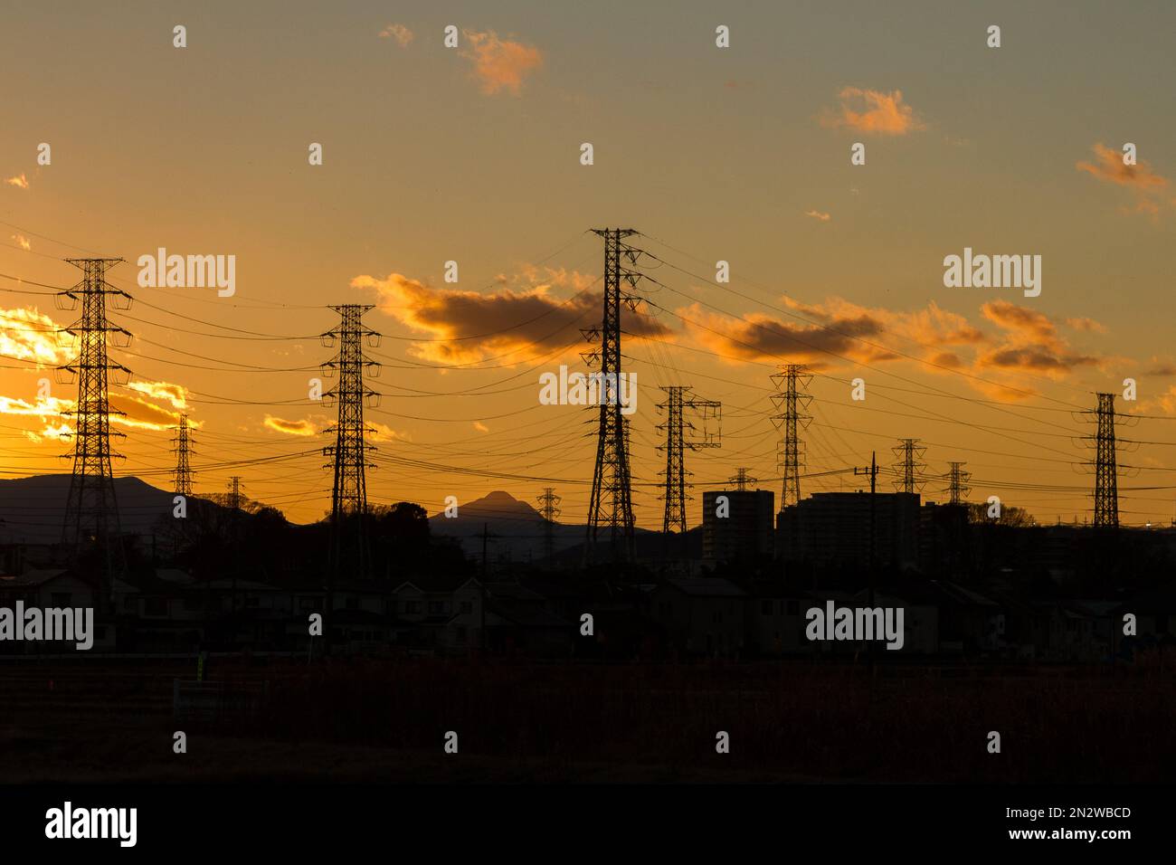 Electricity pylons against a sunset sky in rural Kanagawa, Japan Stock ...
