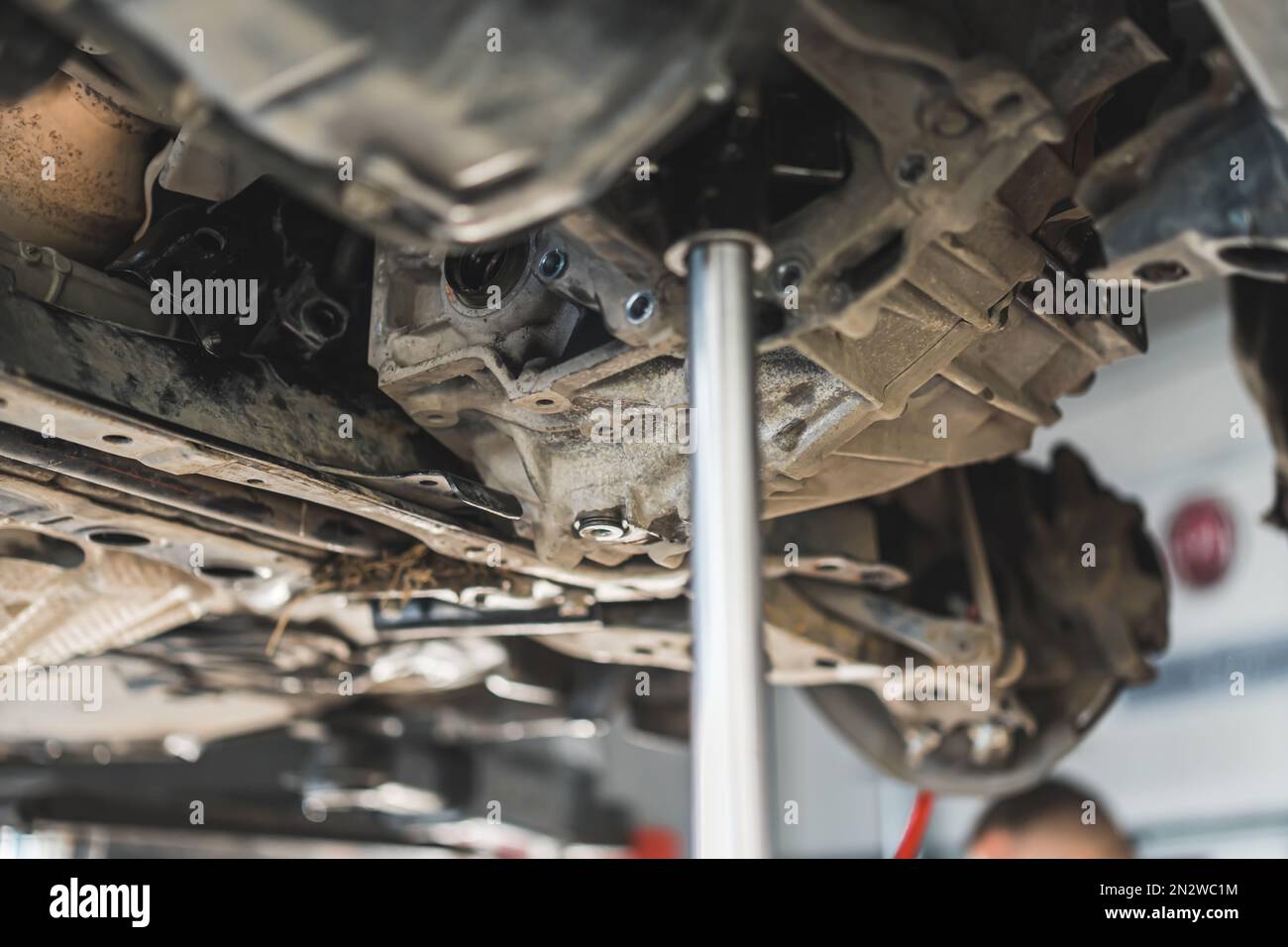 replacing car clutch and gearbox in the auto repair shop, closeup view ...