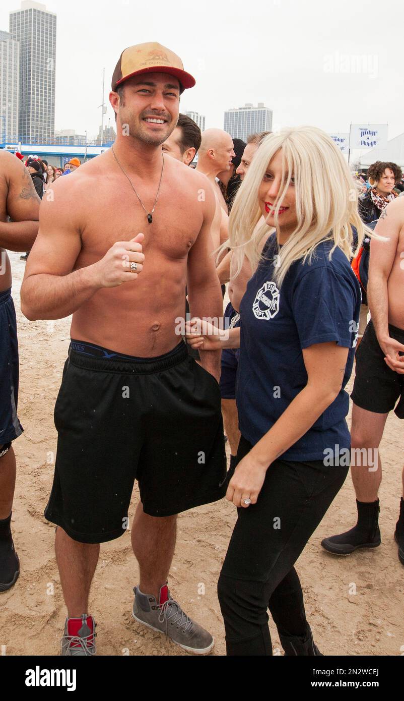 Actor Taylor Kinney and his fiancée pop star Lady Gaga, center, along ...