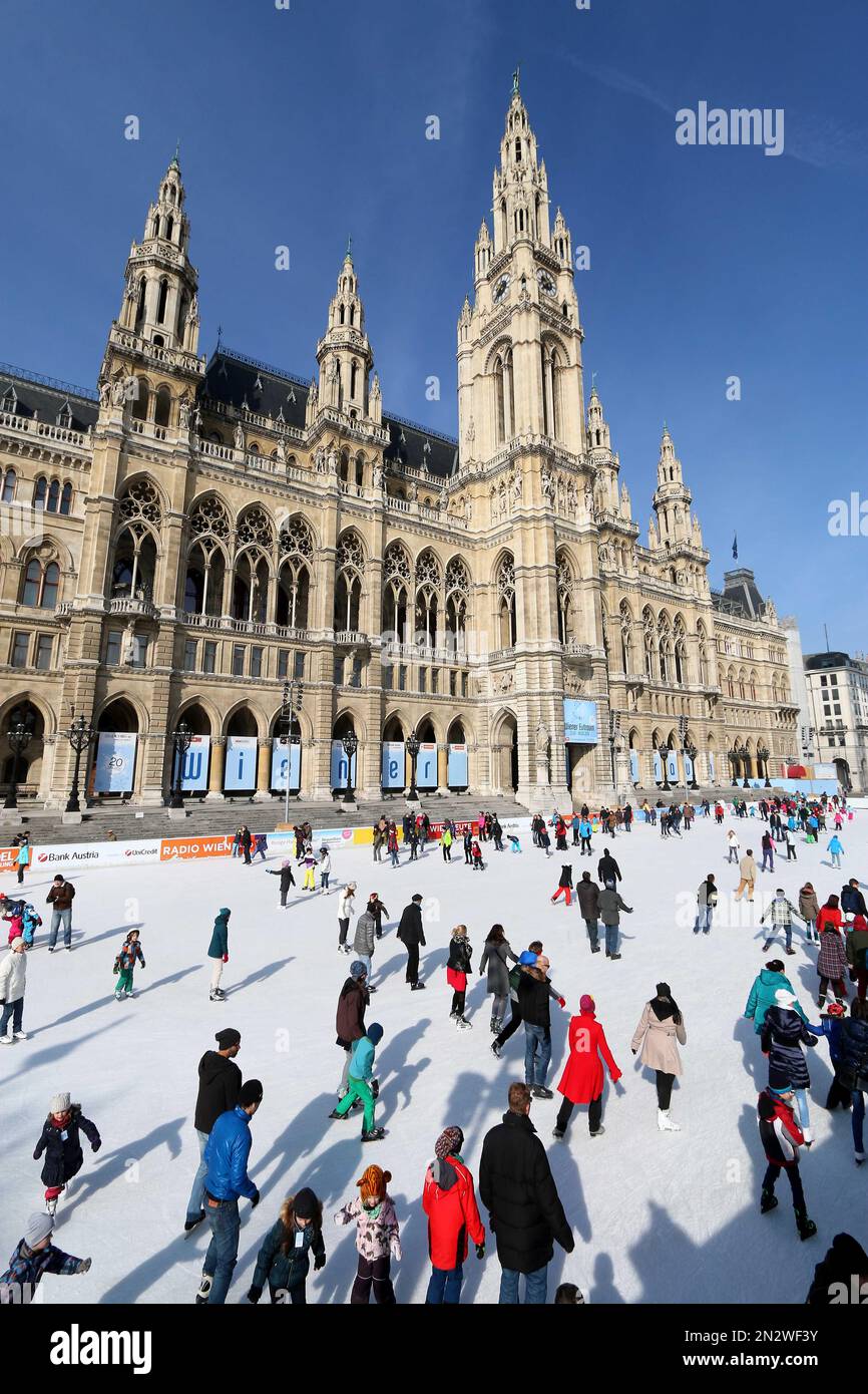 Ice skaters enjoy the city's largest skating rink in front of the city ...