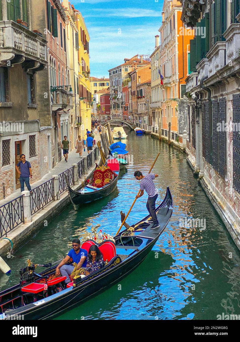 A vertical shot of gondolas in the canal Stock Photo - Alamy
