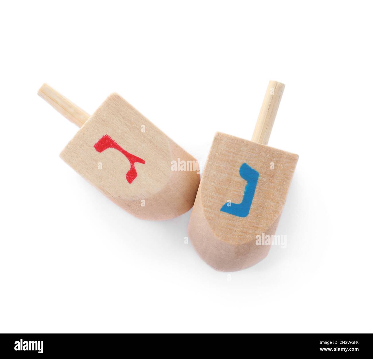 Wooden Hanukkah traditional dreidels with letters Gimel and Nun on ...