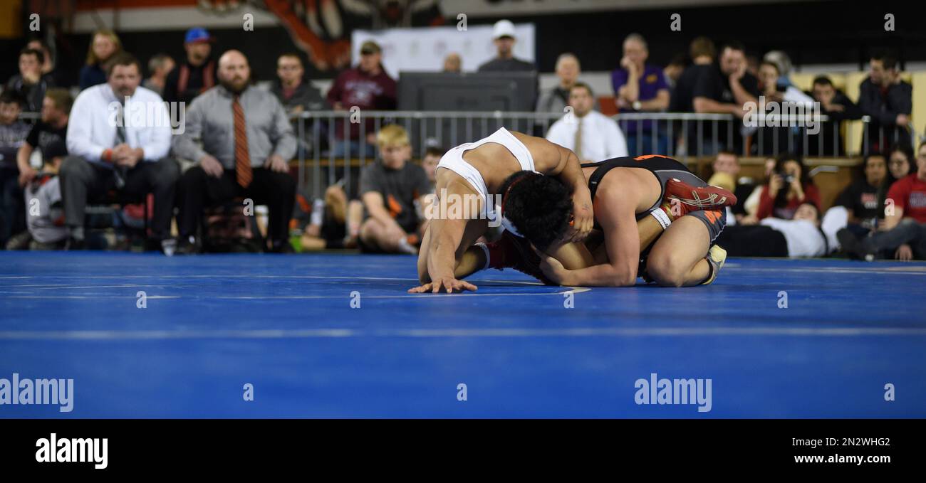 Columbia's Flavio Rosales, left, holds Post Falls' Alius Delarosa ...