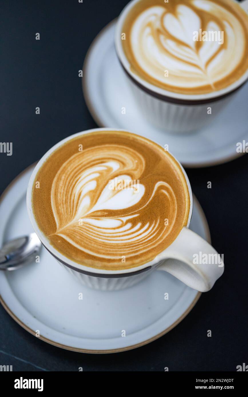 Full-bodied latte coffee with beautiful latte art Stock Photo - Alamy