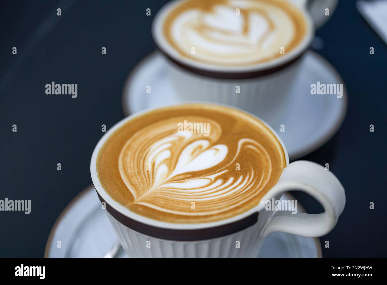 Full-bodied latte coffee with beautiful latte art Stock Photo - Alamy
