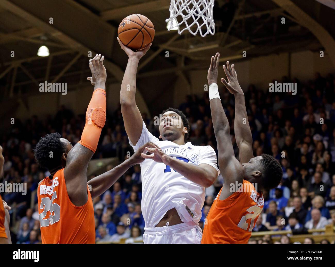 Duke's Jahlil Okafor shoots as Syracuse's Rakeem Christmas (25) and ...